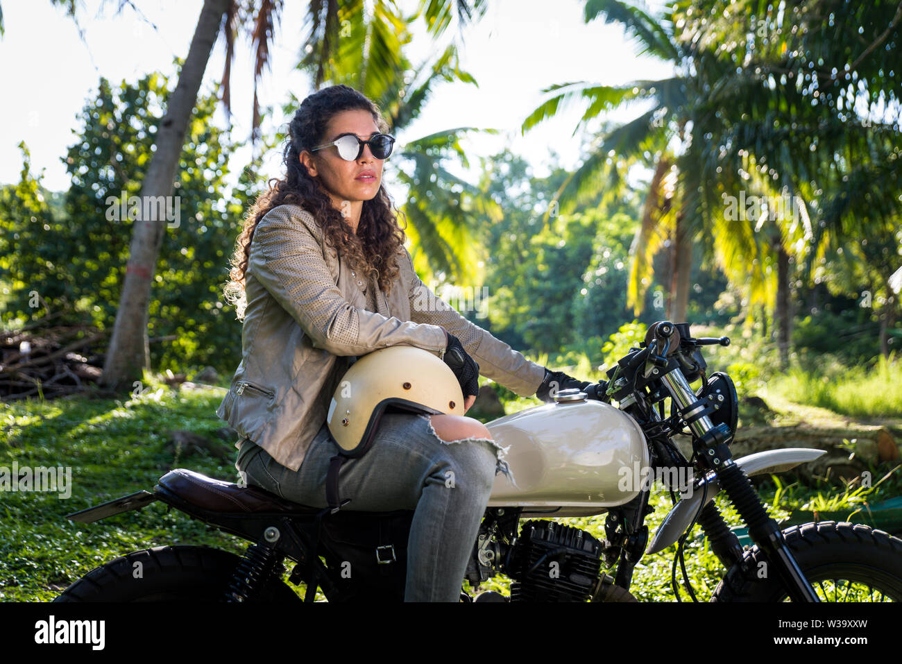 Beautiful female biker driving a cafe' racer motorbike - Pretty girl ...