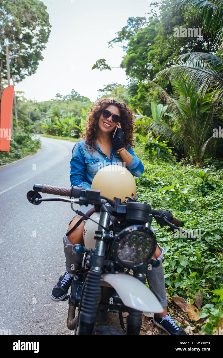 Beautiful female biker driving a cafe' racer motorbike - Pretty girl ...
