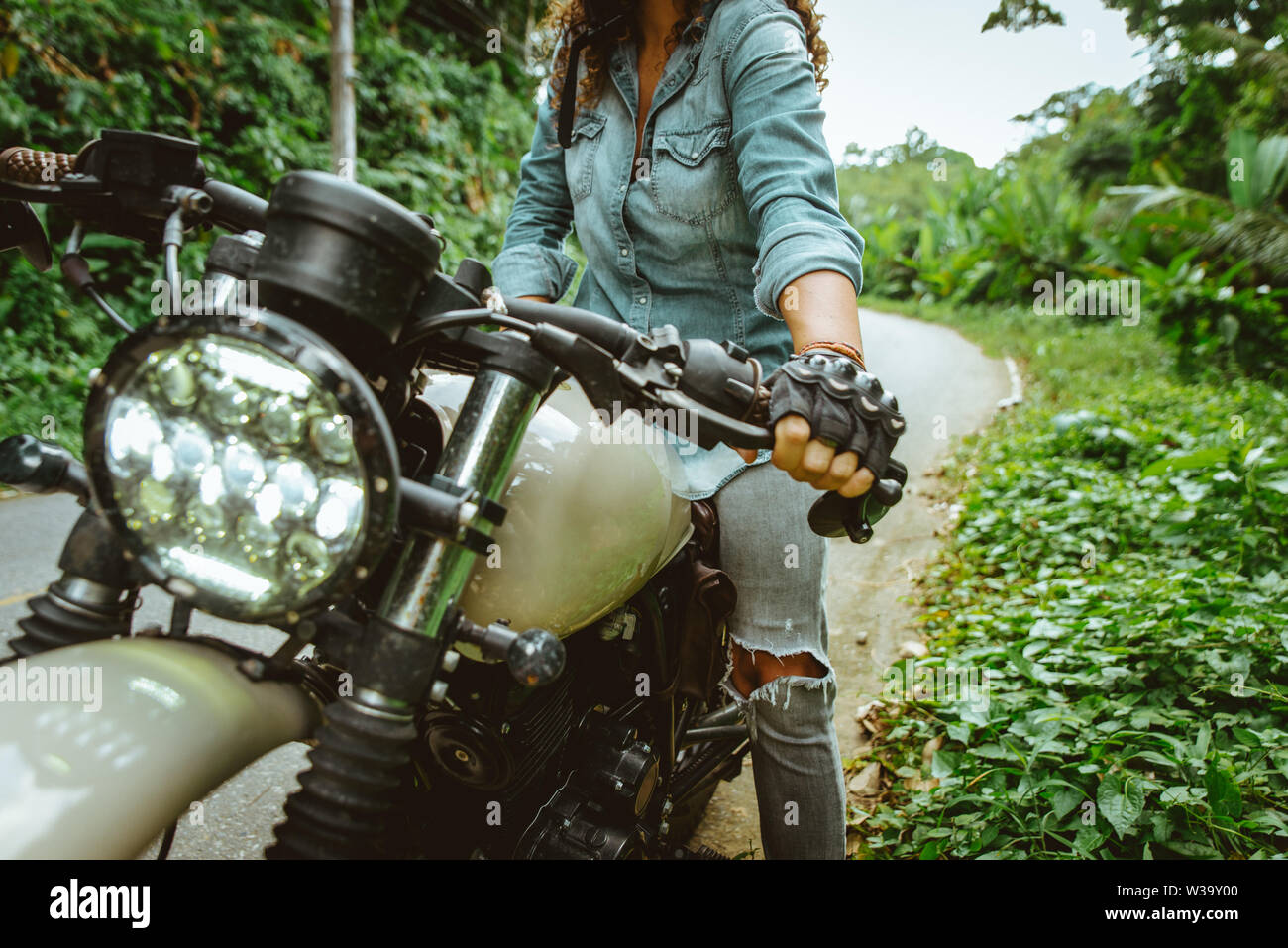 Beautiful female biker driving a cafe' racer motorbike - Pretty girl ...