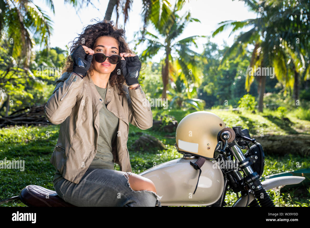 Beautiful female biker driving a cafe' racer motorbike - Pretty girl ...