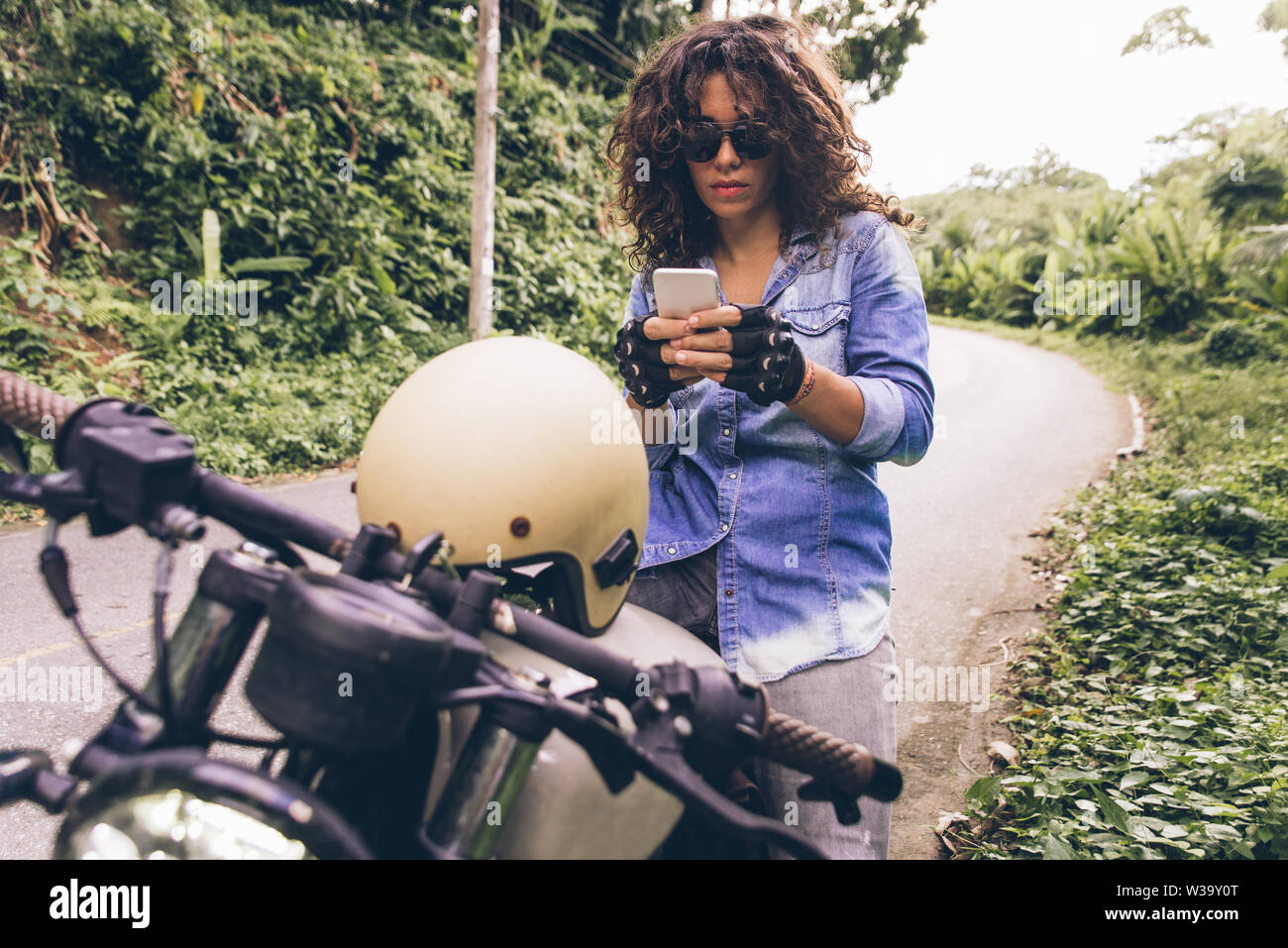 Beautiful female biker driving a cafe' racer motorbike - Pretty girl ...