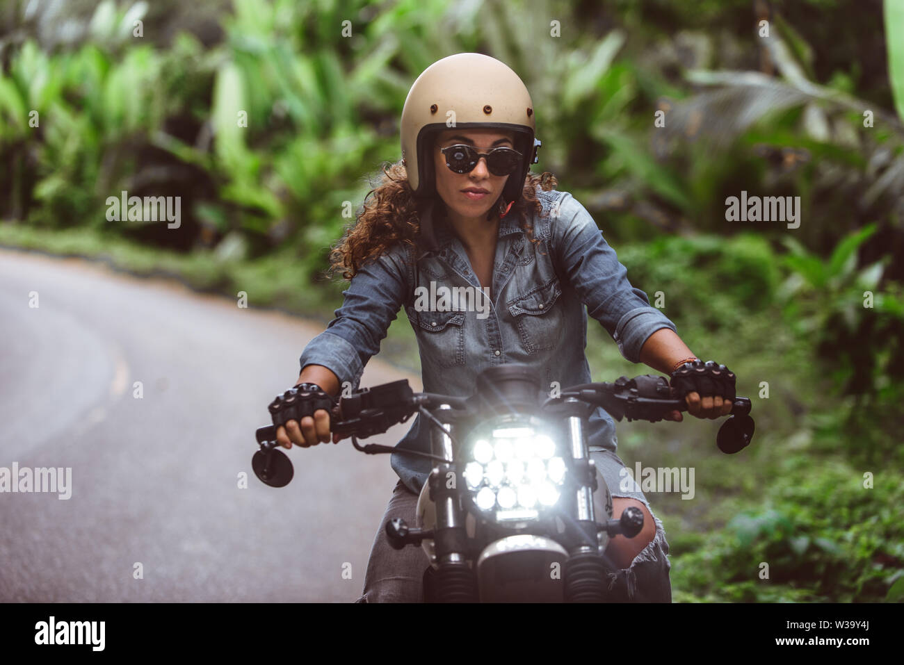 Beautiful female biker driving a cafe' racer motorbike - Pretty girl ...