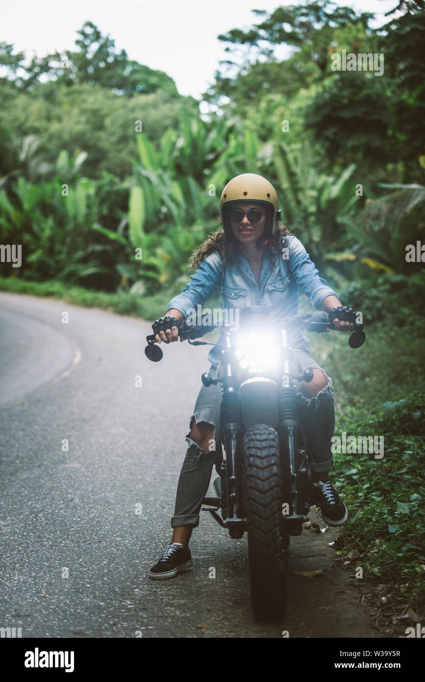 Beautiful female biker driving a cafe' racer motorbike - Pretty girl ...