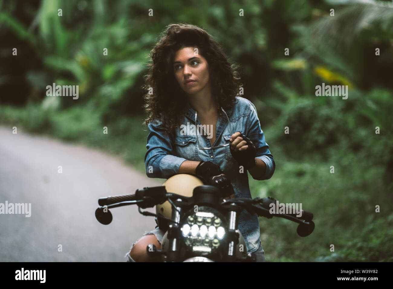 Beautiful female biker driving a cafe' racer motorbike - Pretty girl ...