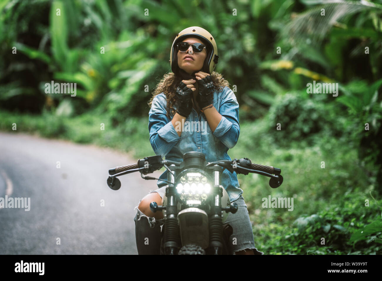 Beautiful female biker driving a cafe' racer motorbike - Pretty girl ...