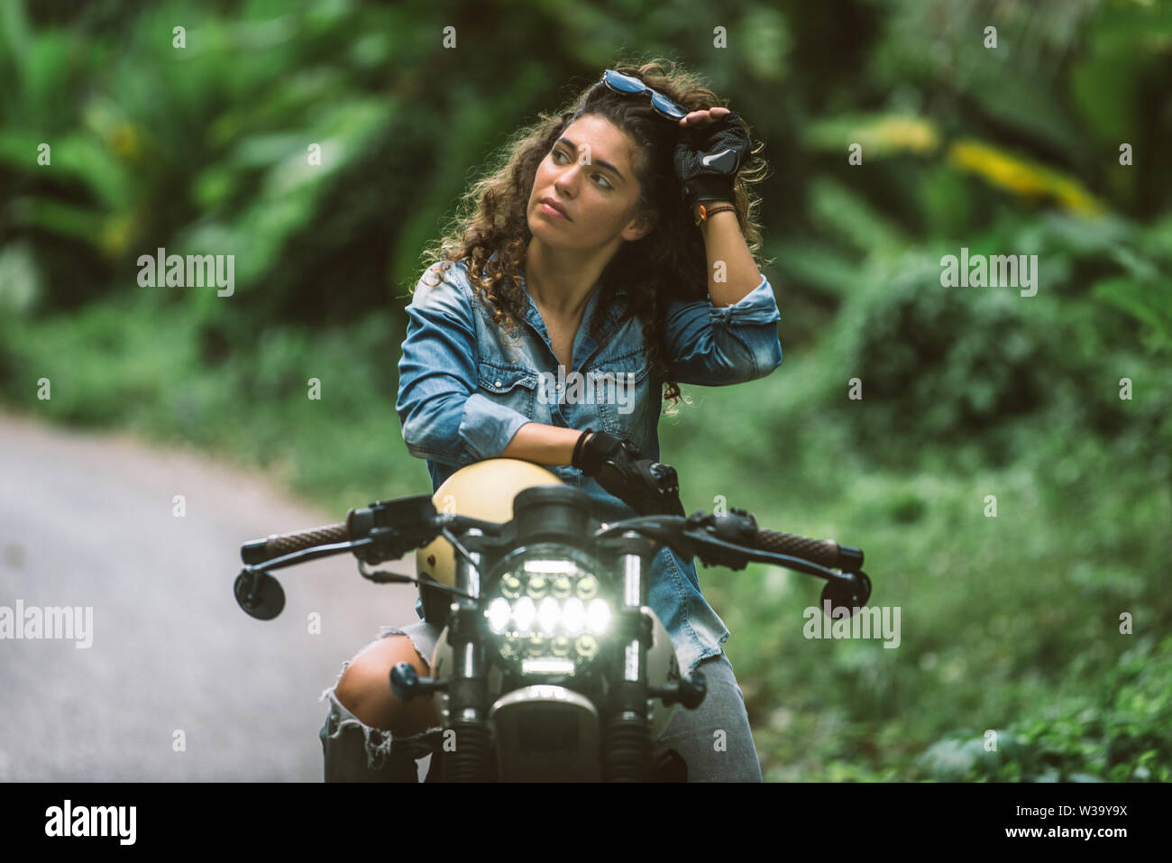 Beautiful female biker driving a cafe' racer motorbike - Pretty girl ...