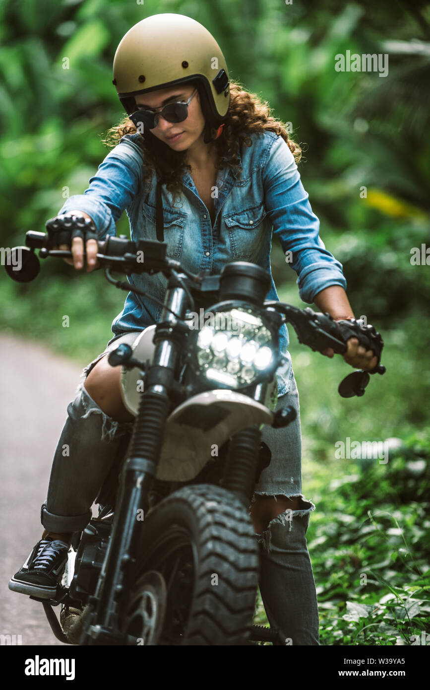 Beautiful female biker driving a cafe' racer motorbike - Pretty girl ...