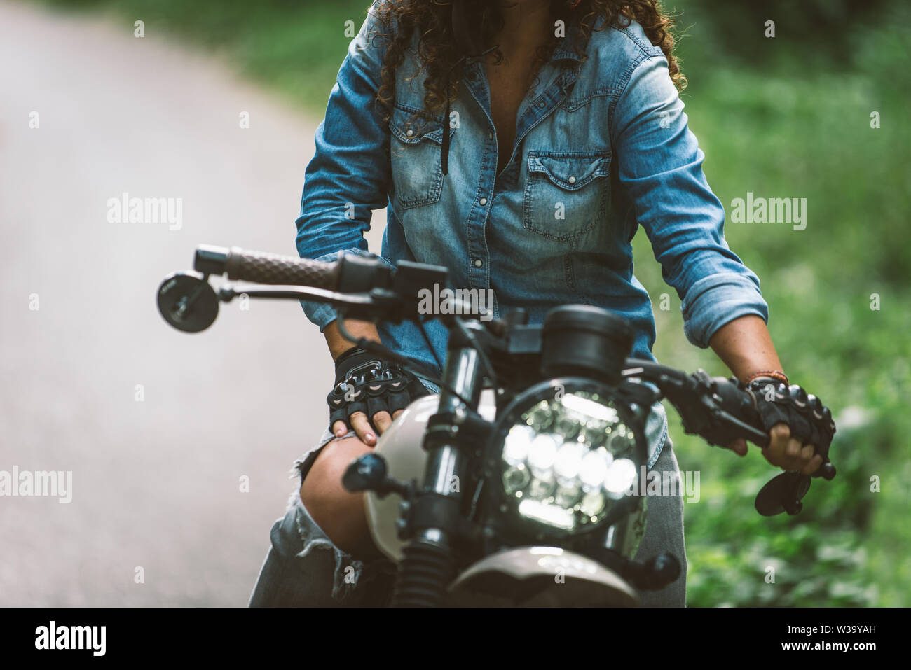 Beautiful female biker driving a cafe' racer motorbike - Pretty girl ...
