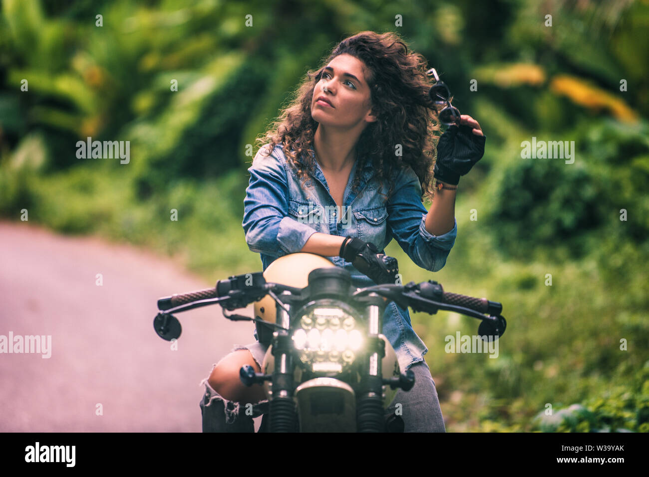 Beautiful female biker driving a cafe' racer motorbike - Pretty girl ...