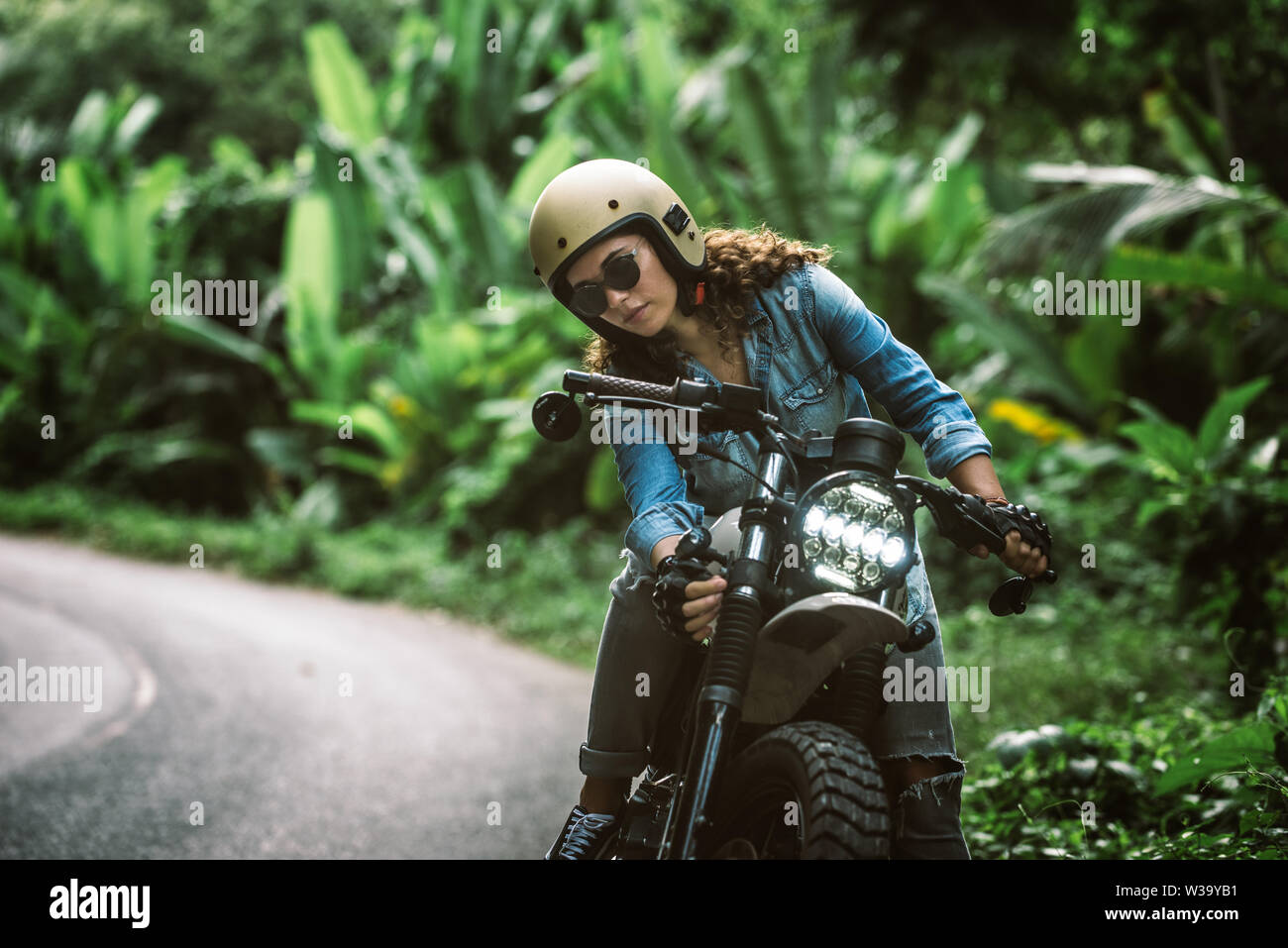 Beautiful female biker driving a cafe' racer motorbike - Pretty girl ...