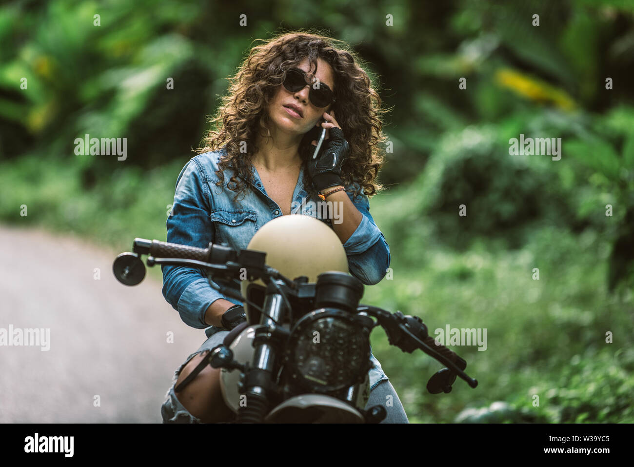 Beautiful female biker driving a cafe' racer motorbike - Pretty girl ...