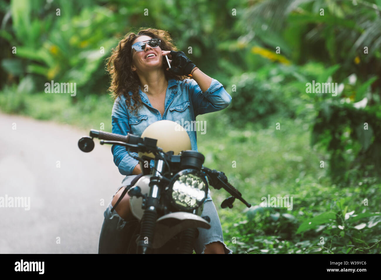 Beautiful female biker driving a cafe' racer motorbike - Pretty girl ...