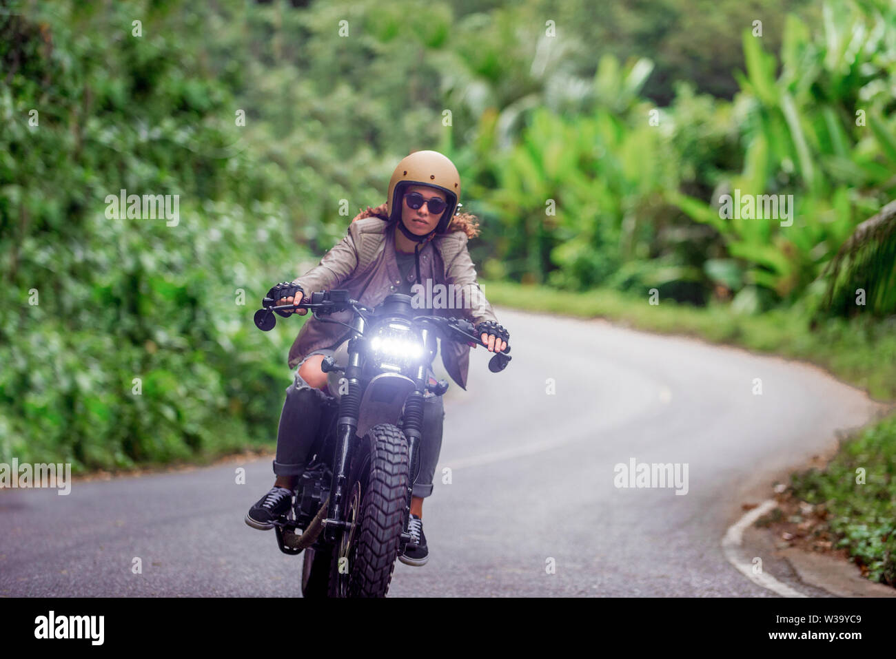 Beautiful female biker driving a cafe' racer motorbike - Pretty girl ...