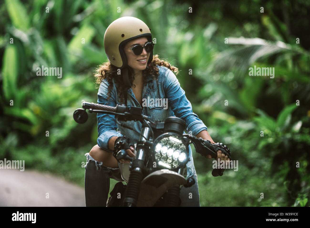 Beautiful female biker driving a cafe' racer motorbike - Pretty girl ...