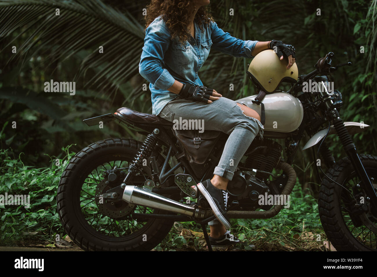 Beautiful female biker driving a cafe' racer motorbike - Pretty girl ...