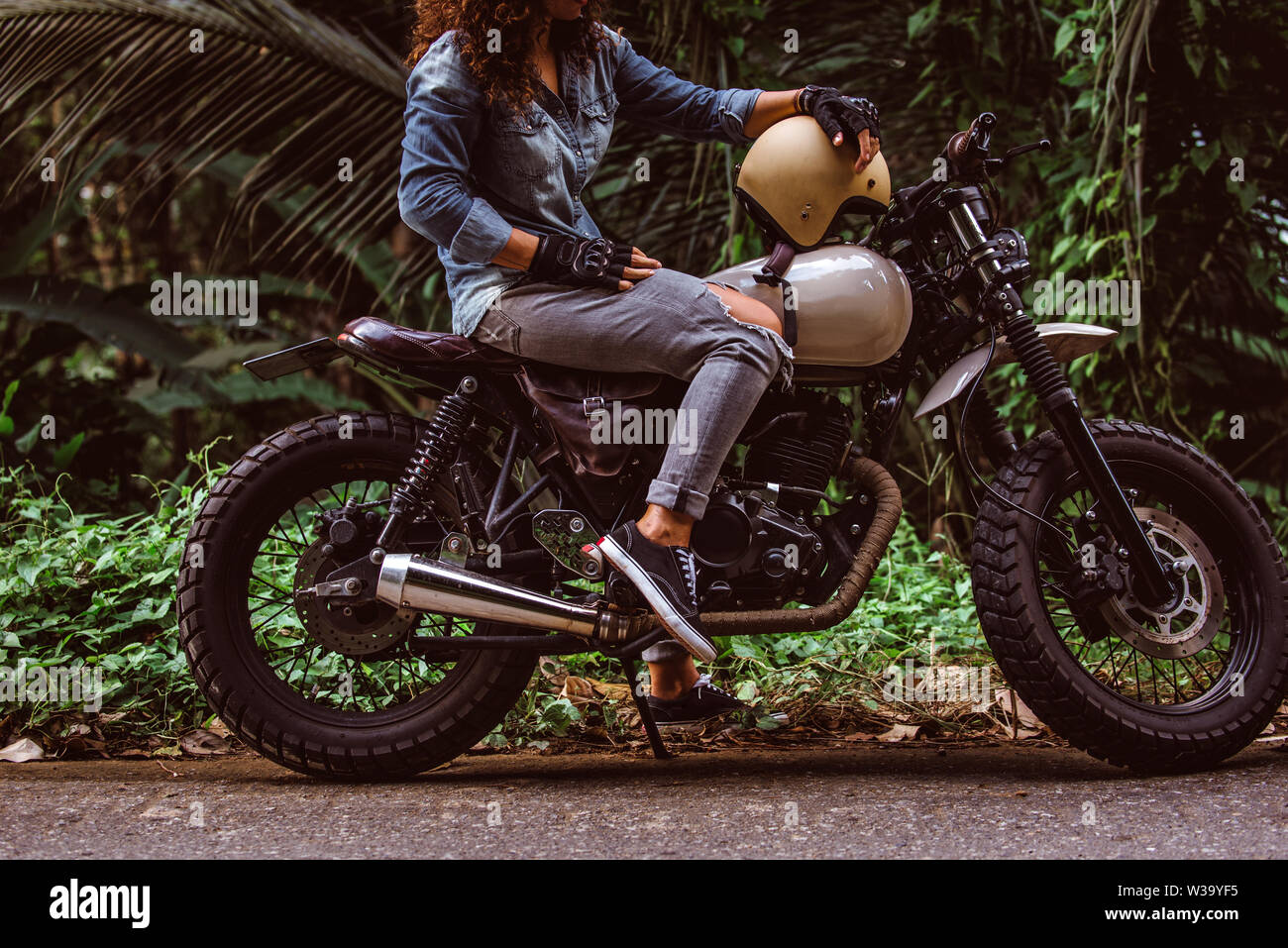 Beautiful female biker driving a cafe' racer motorbike - Pretty girl ...
