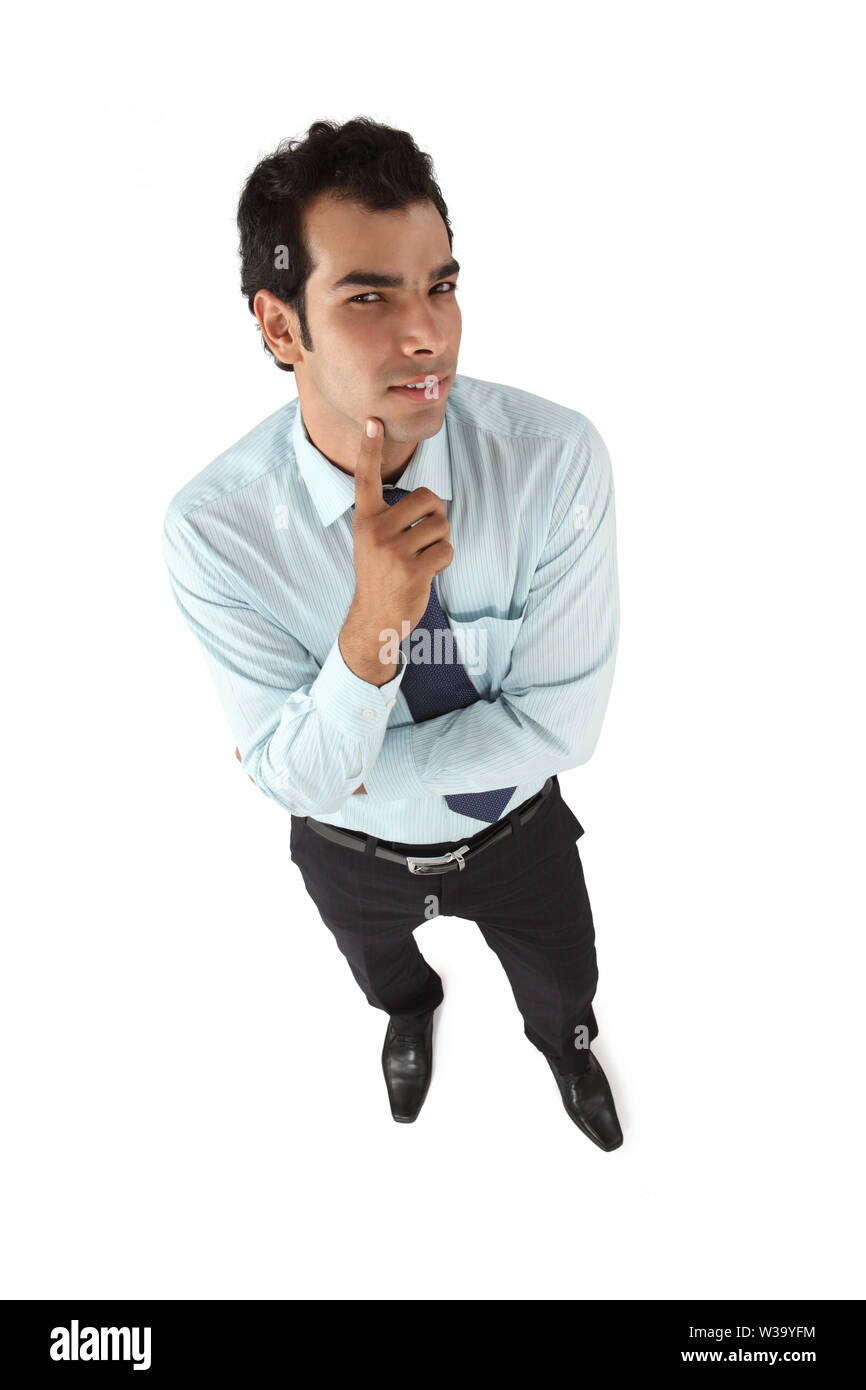 Indian business man thinking Cut Out Stock Images & Pictures - Alamy
