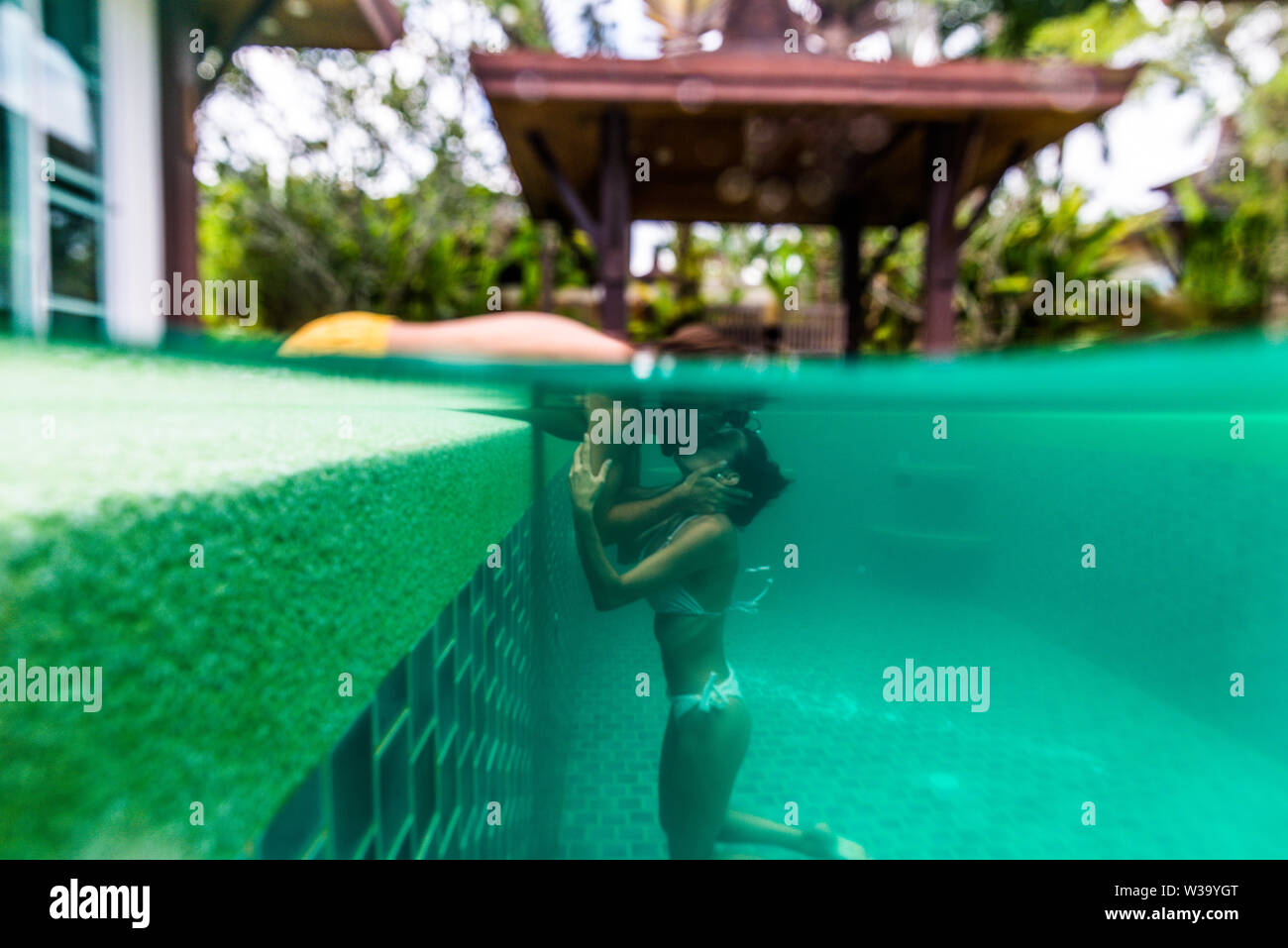 Couple Of Lovers In A Beautiful Villa With Swimming Pool In A Tropical