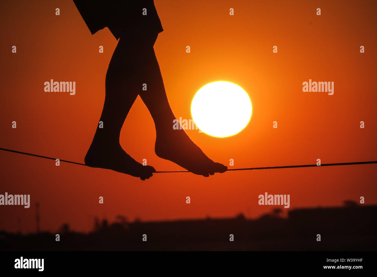 Balanced on the tightrope at sunset in Melbourne Australia Stock Photo ...
