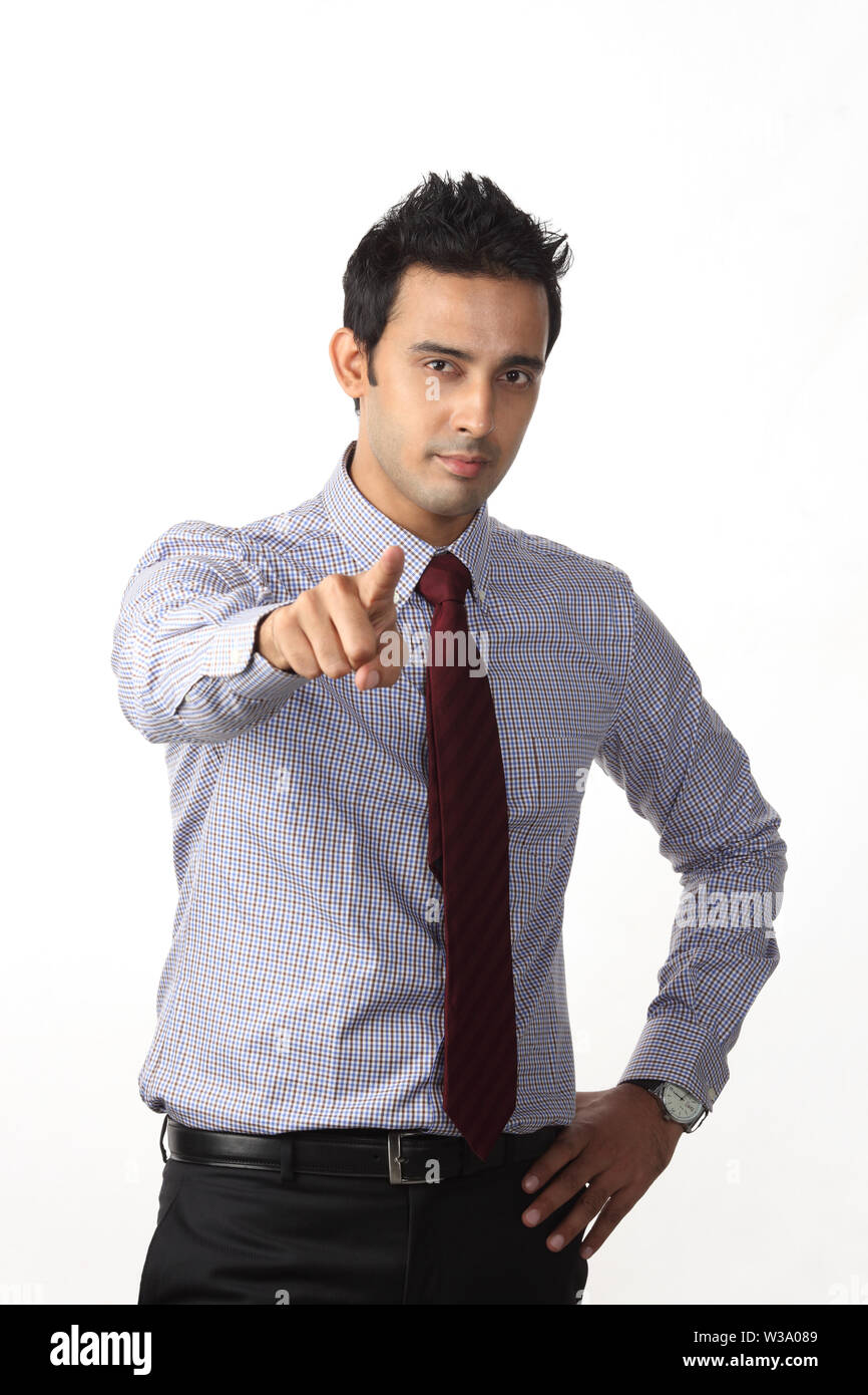 Portrait of a businessman pointing finger Stock Photo - Alamy