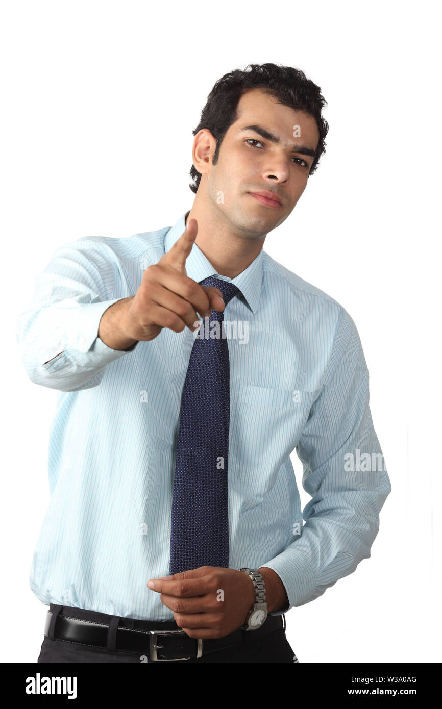 Portrait of a businessman pointing finger Stock Photo - Alamy