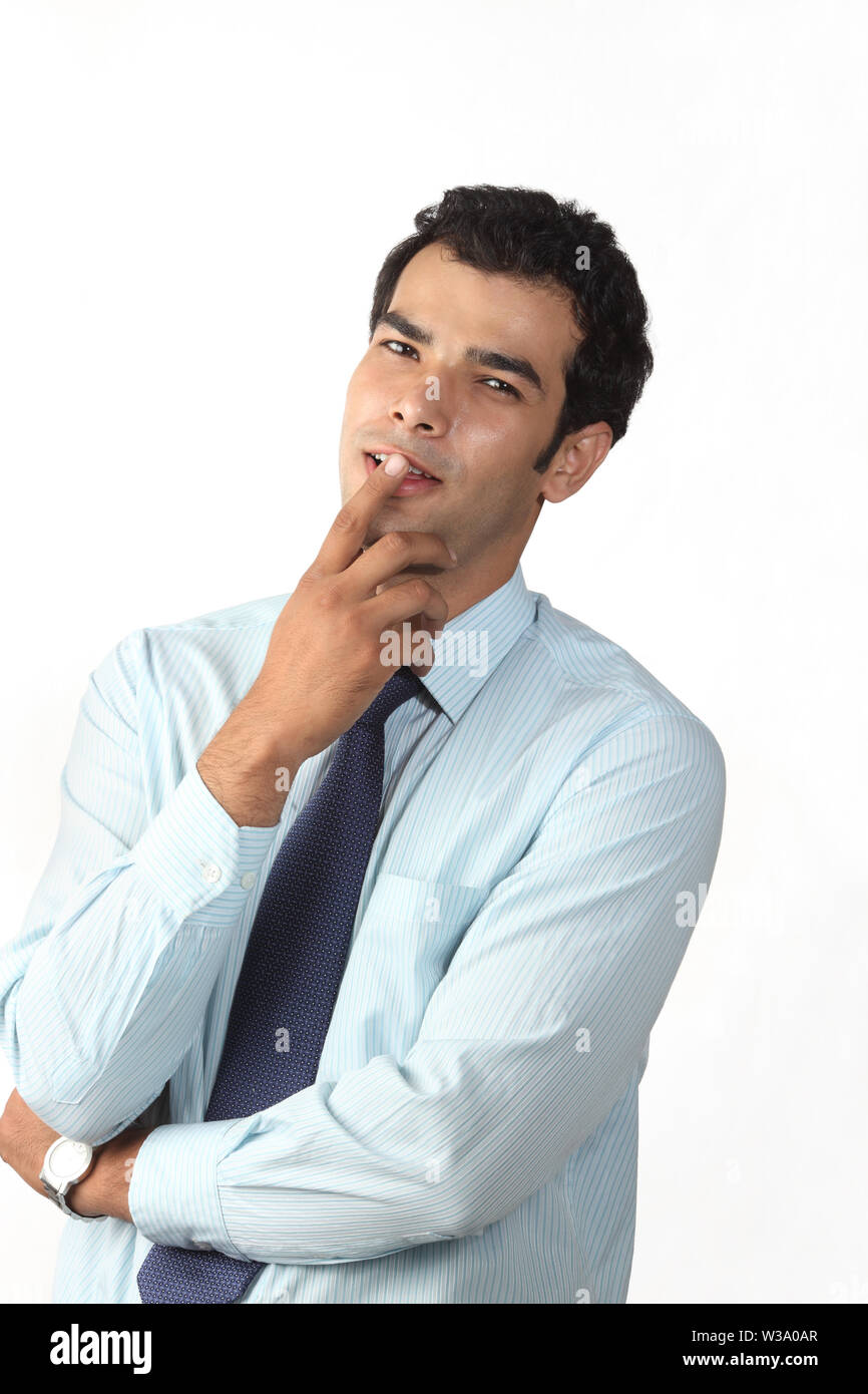 Portrait of a businessman thinking Stock Photo - Alamy