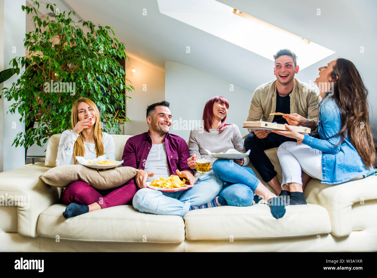 Group of happy friends bonding at home - Young adults having party and ...