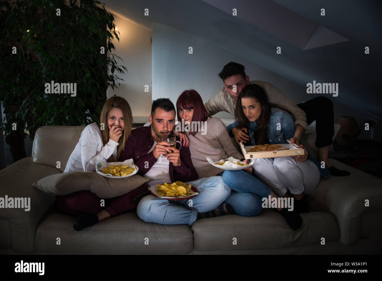 Group of happy friends bonding at home - Young adults having party and ...