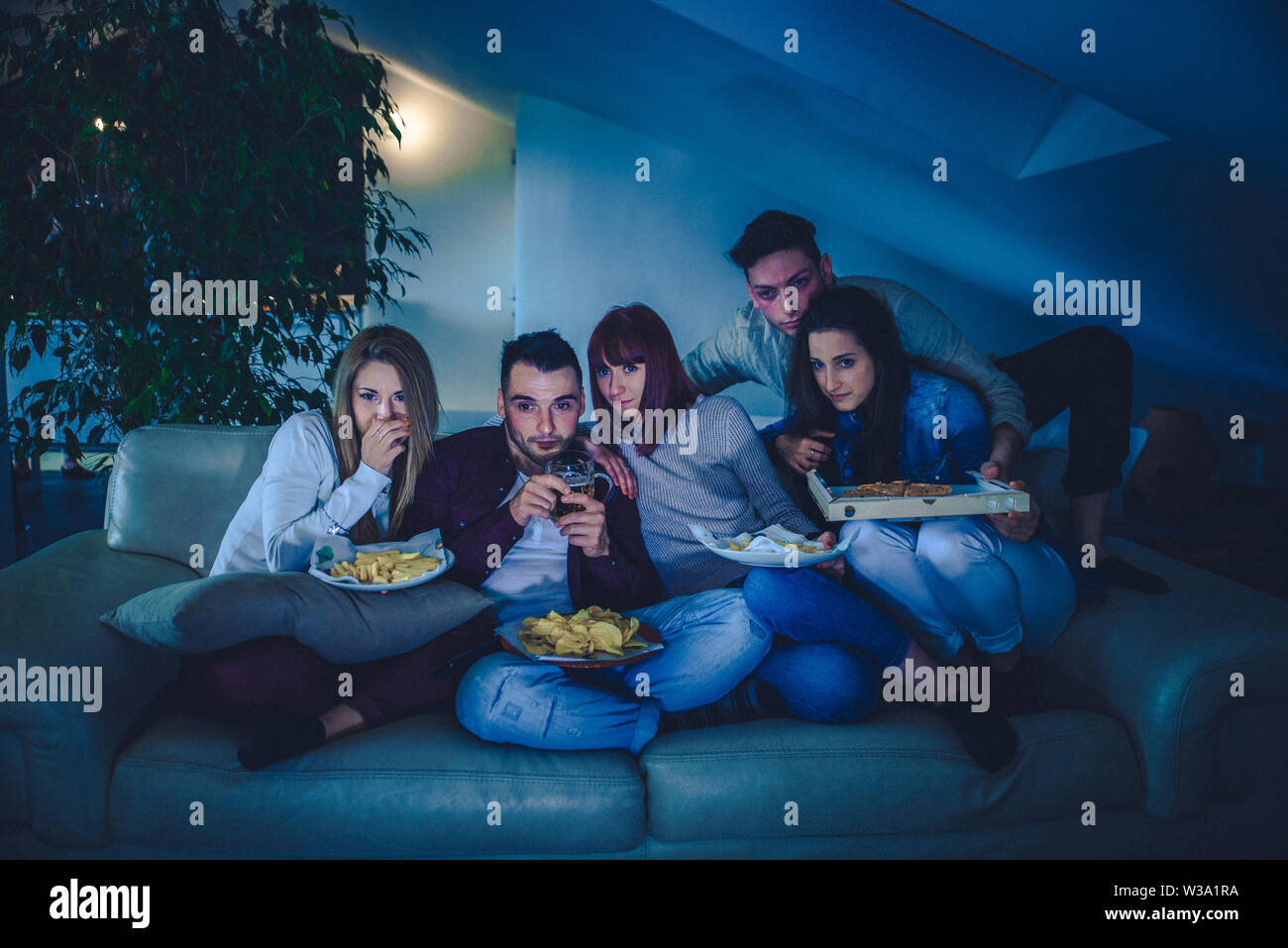 Group of happy friends bonding at home - Young adults having party and ...