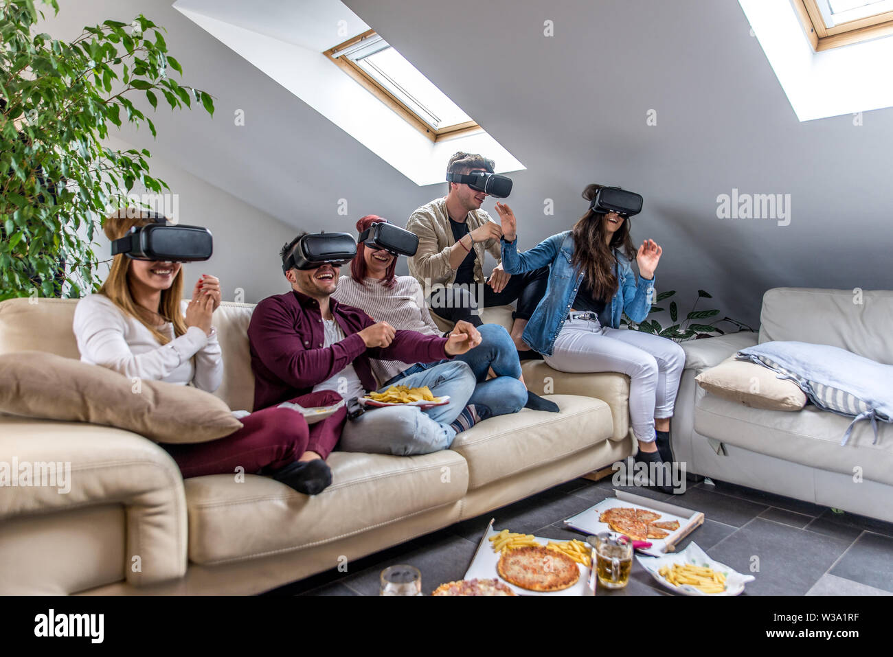 Group of happy friends bonding at home - Young adults having party and ...
