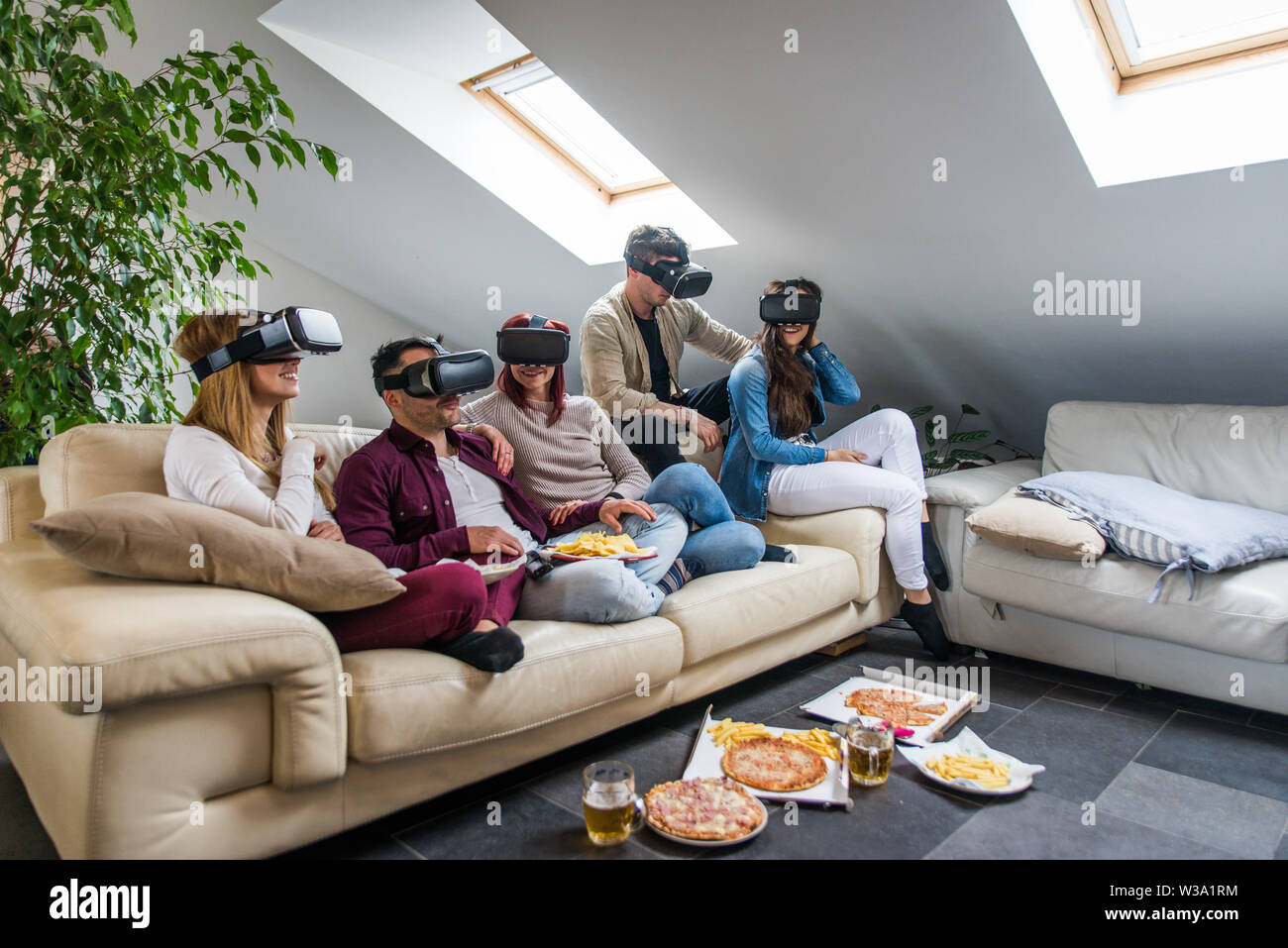 Group of happy friends bonding at home - Young adults having party and ...