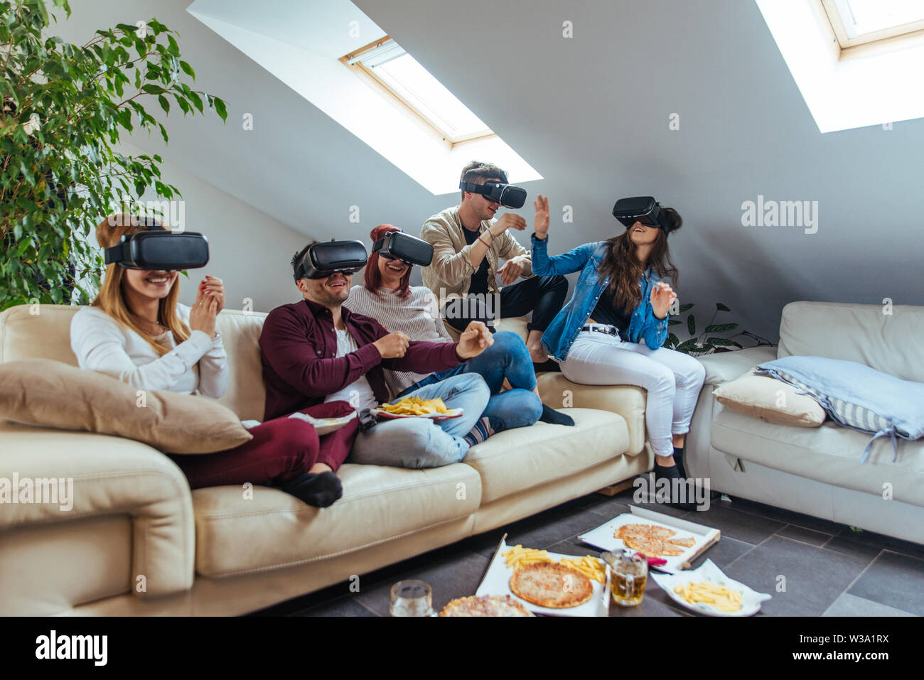 Group of happy friends bonding at home - Young adults having party and ...