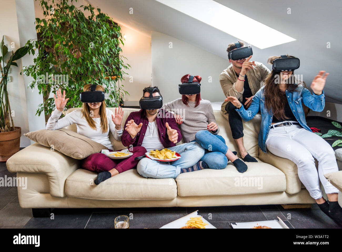 Group of happy friends bonding at home - Young adults having party and ...