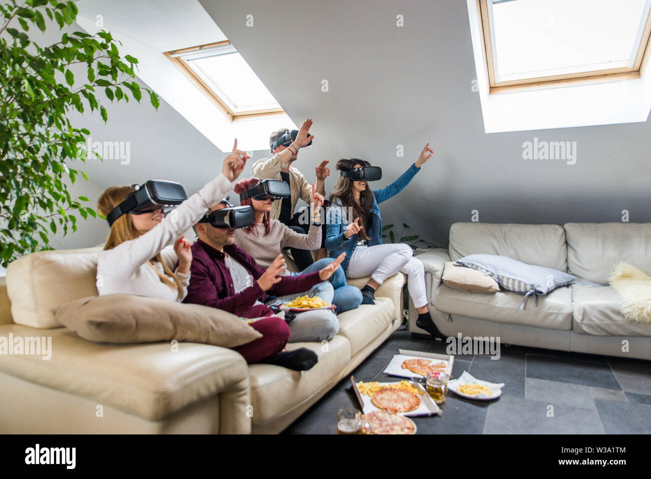 Group of happy friends bonding at home - Young adults having party and ...