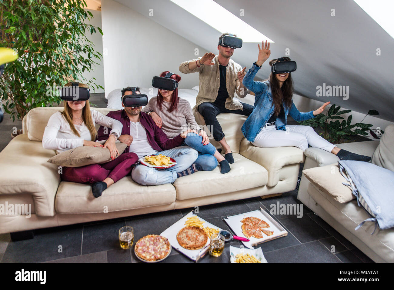 Group of happy friends bonding at home - Young adults having party and ...