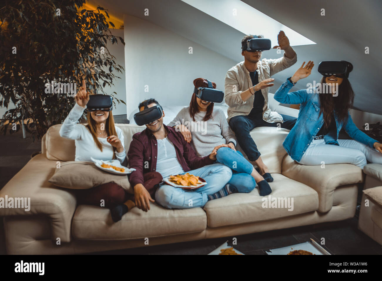 Group of happy friends bonding at home - Young adults having party and ...