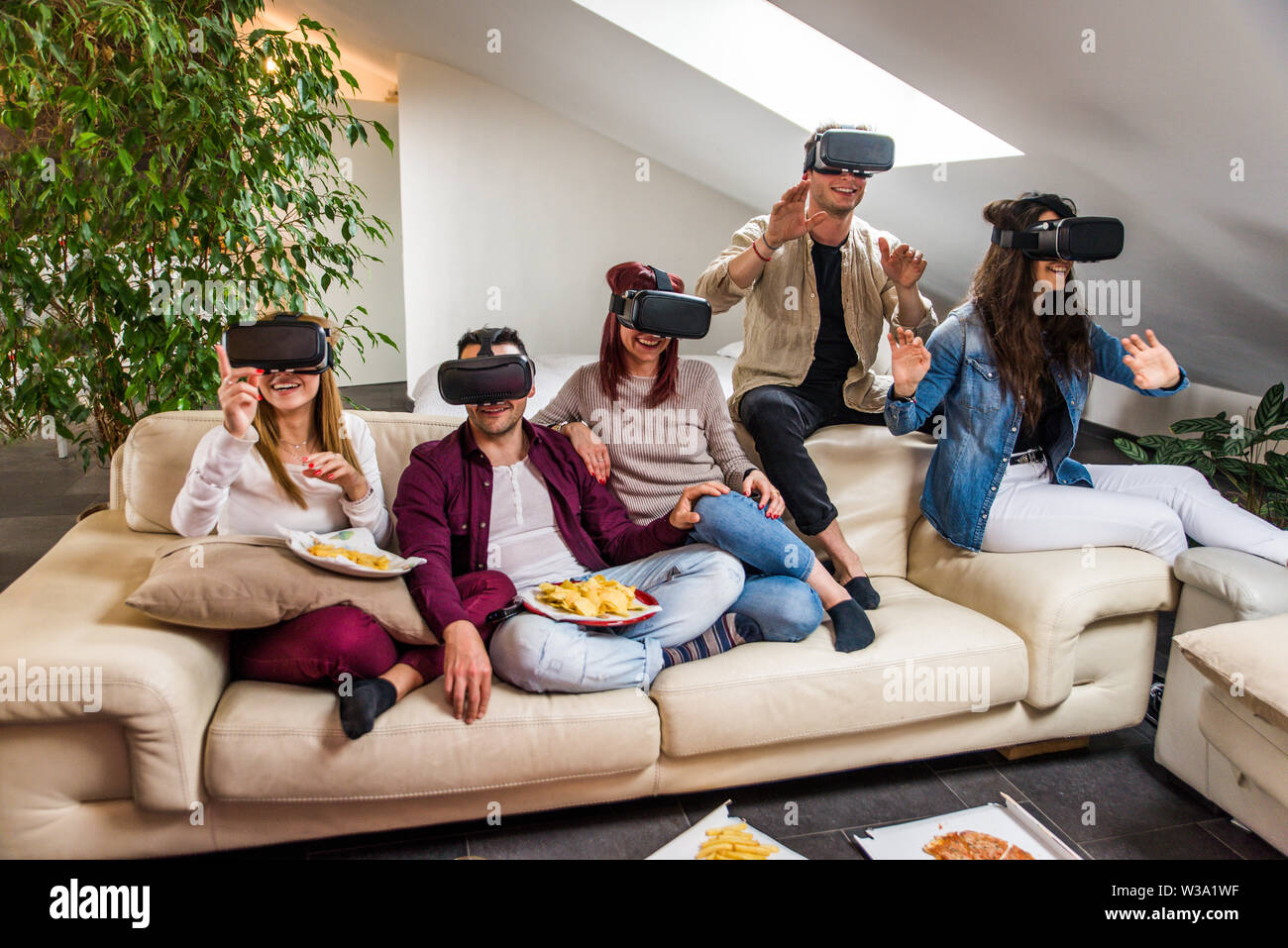 Group of happy friends bonding at home - Young adults having party and ...