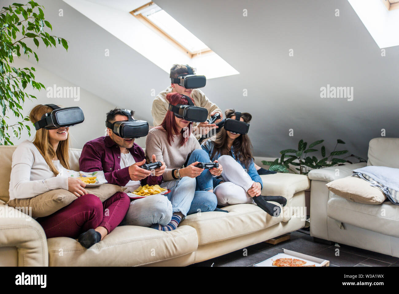 Group of happy friends bonding at home - Young adults having party and ...