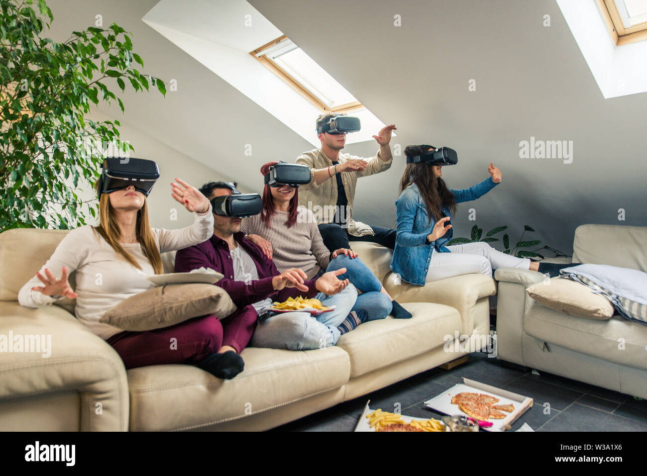 Group of happy friends bonding at home - Young adults having party and ...