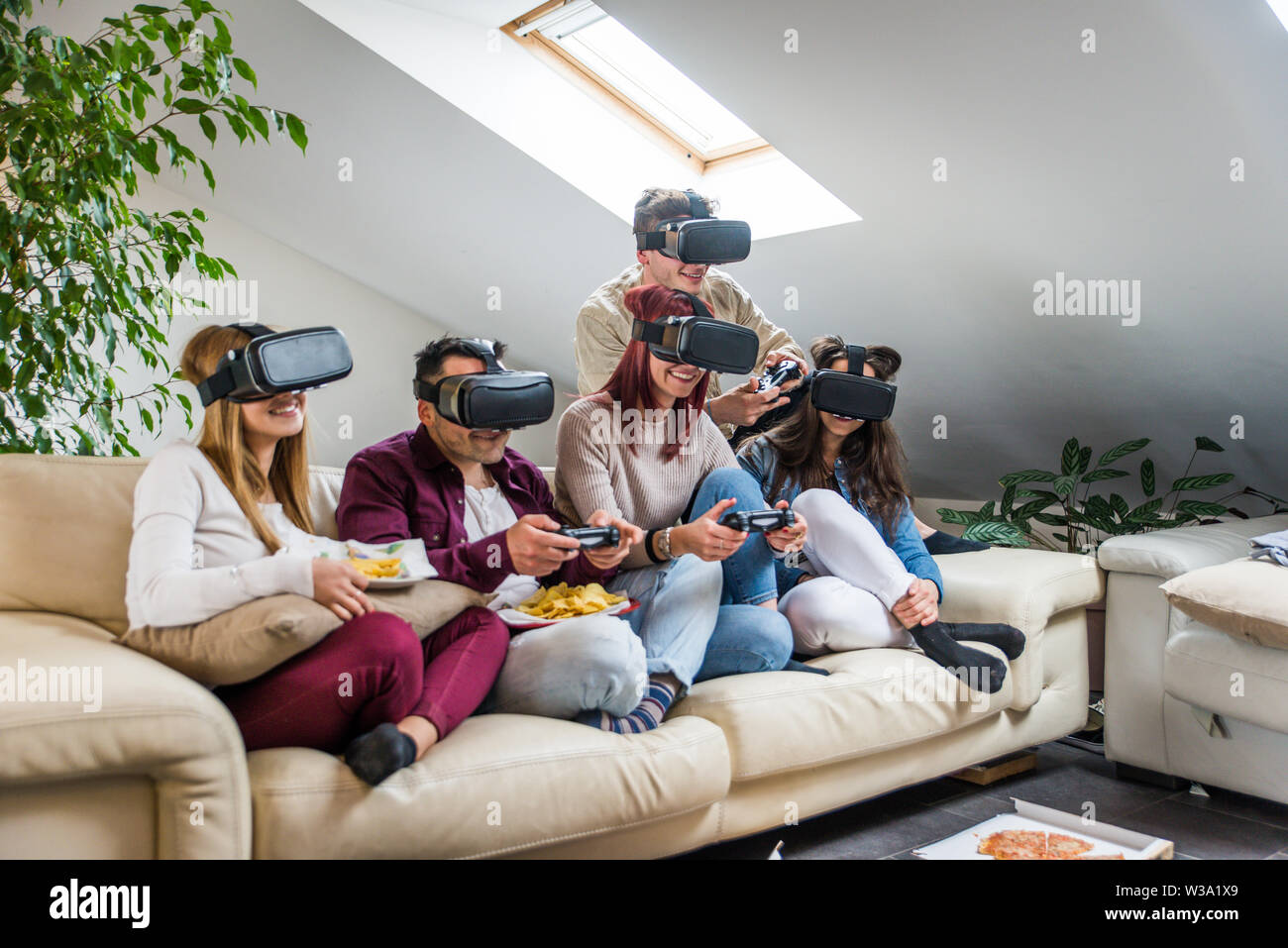 Group of happy friends bonding at home - Young adults having party and ...