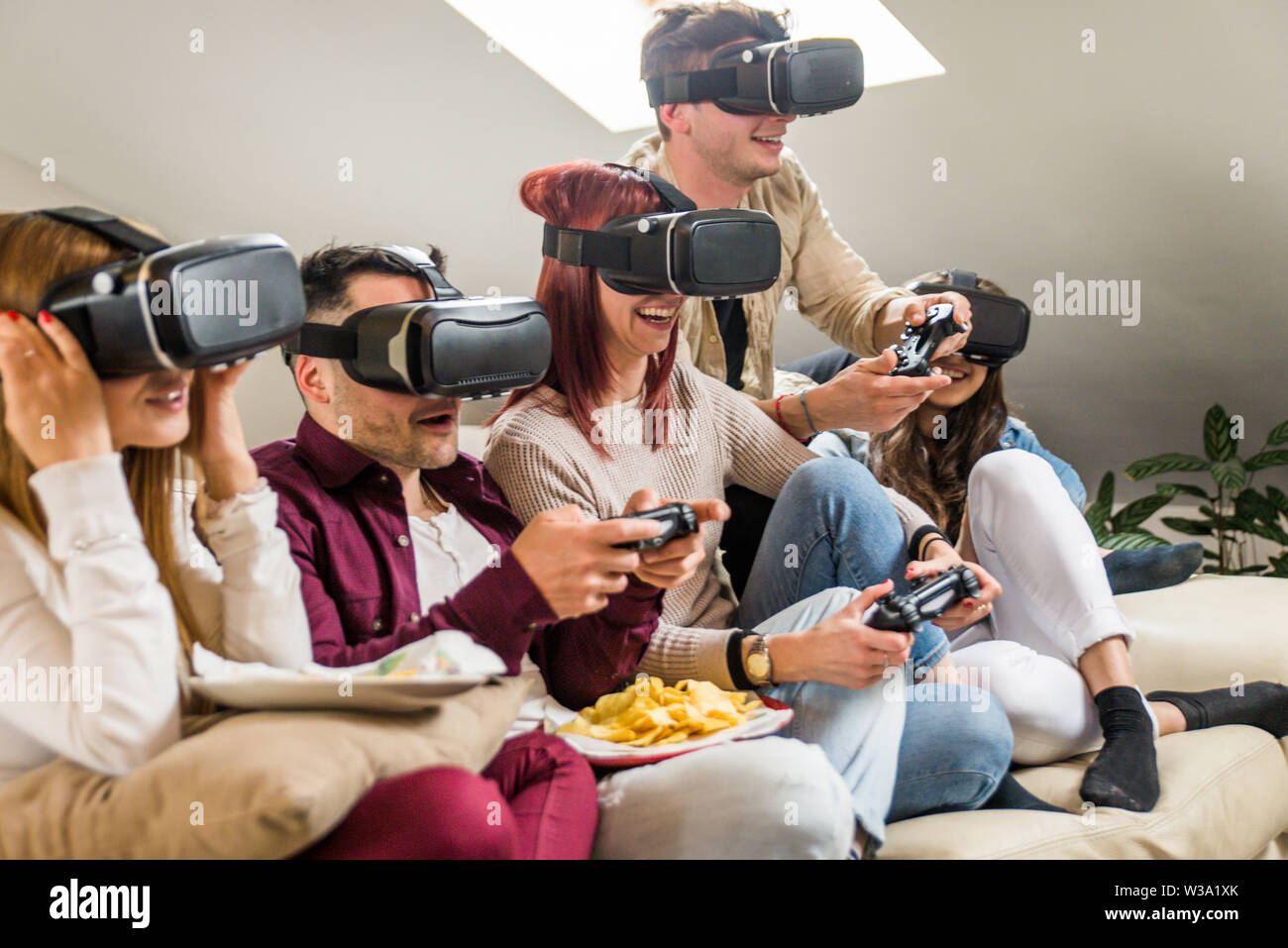 Group of happy friends bonding at home - Young adults having party and ...
