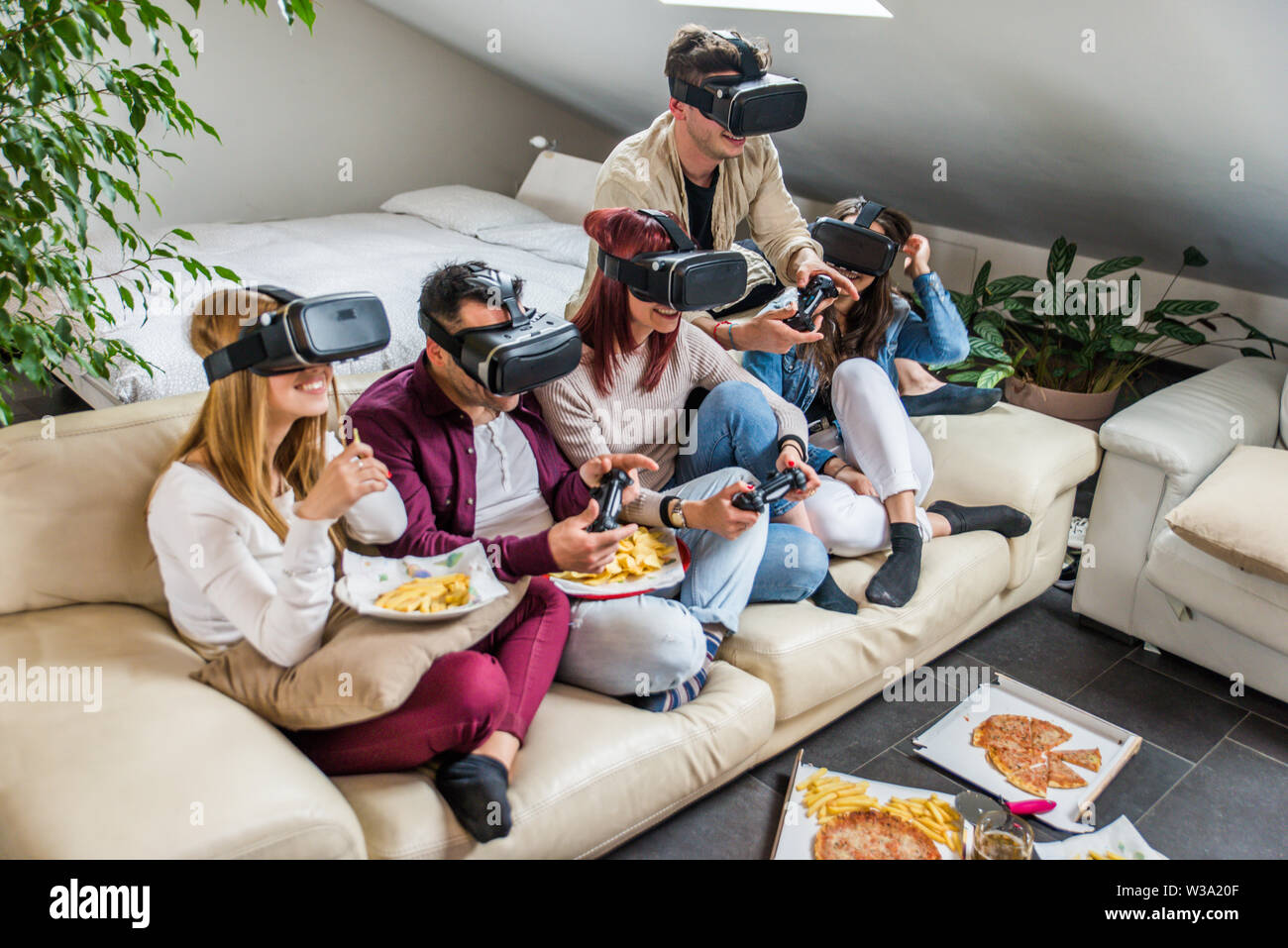 Group of happy friends bonding at home - Young adults having party and ...