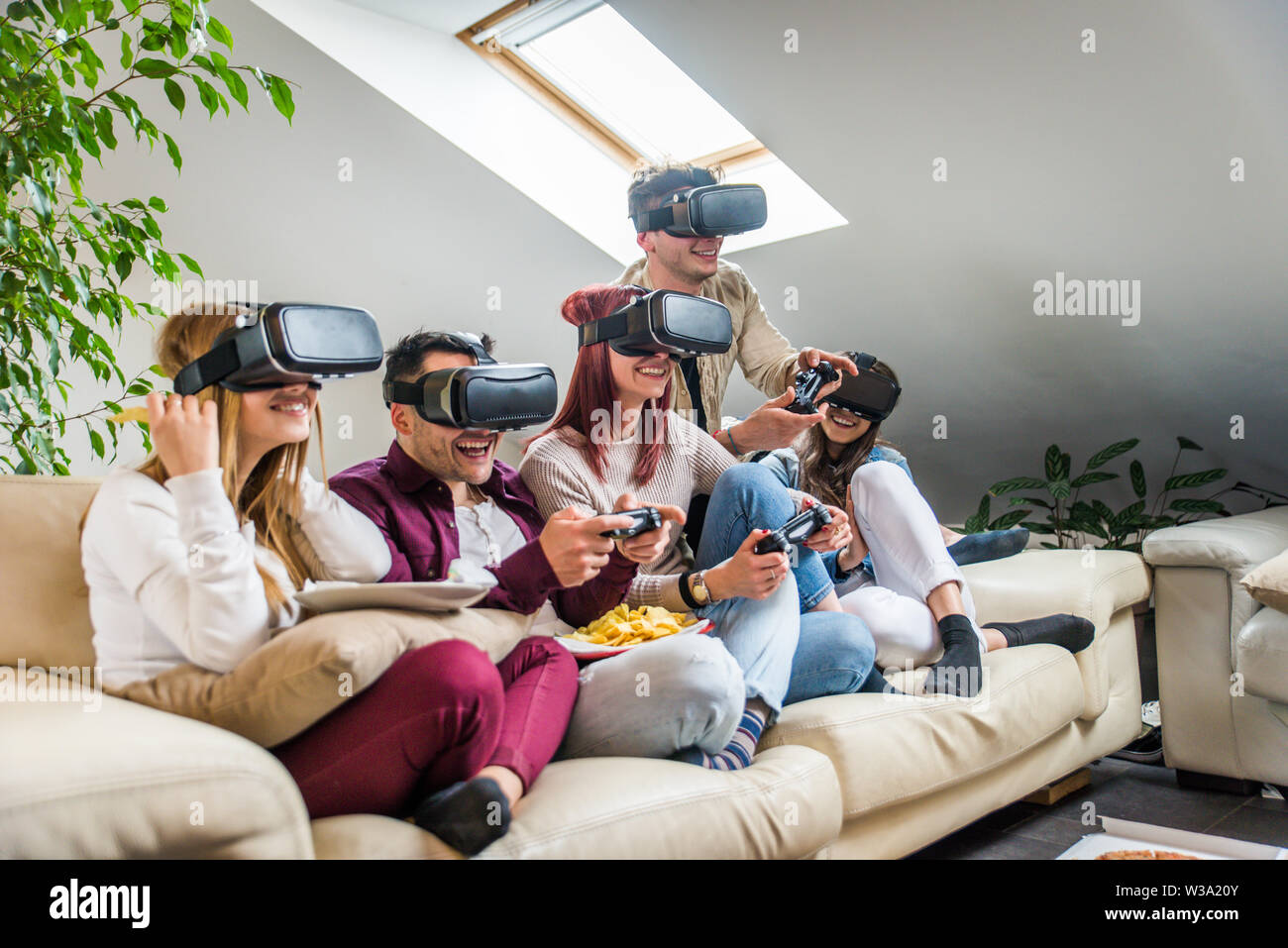 Group of happy friends bonding at home - Young adults having party and ...