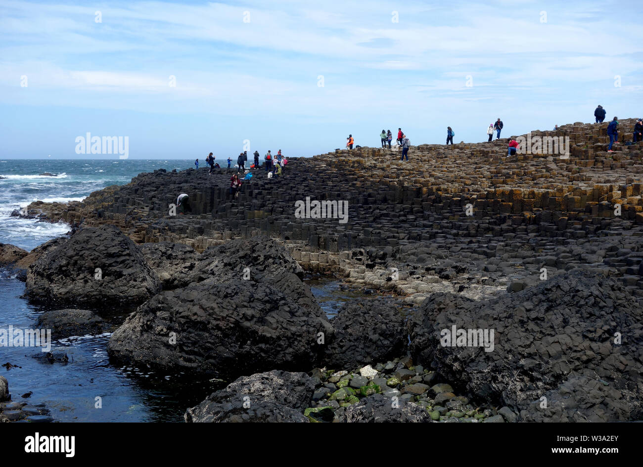 Visitors on the Top of Black Hexagonal Interlocking Basalt Columns on ...