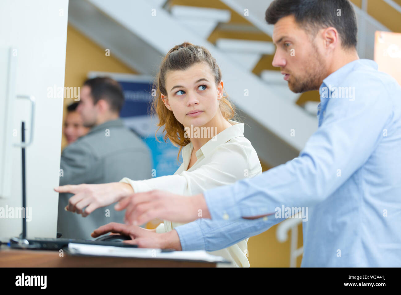 female student point at lapton Stock Photo - Alamy