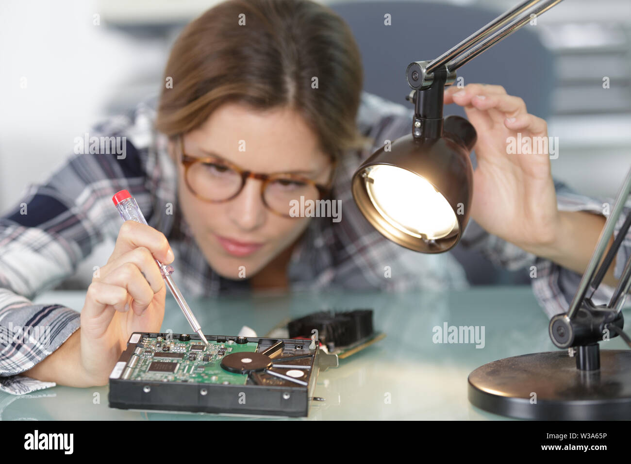 woman fixing a desktop computer Stock Photo - Alamy