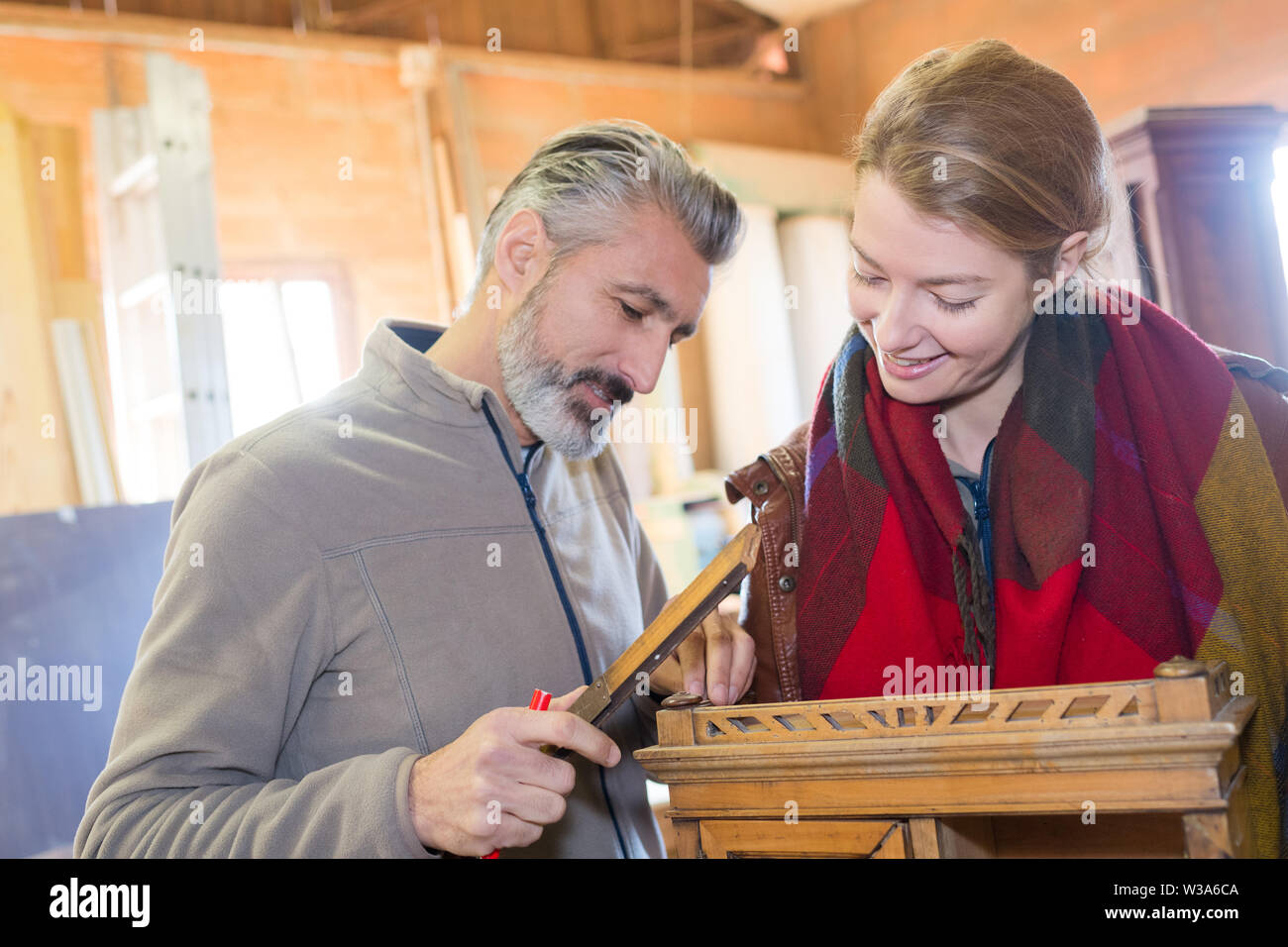male woodworker fixing old furniture Stock Photo - Alamy