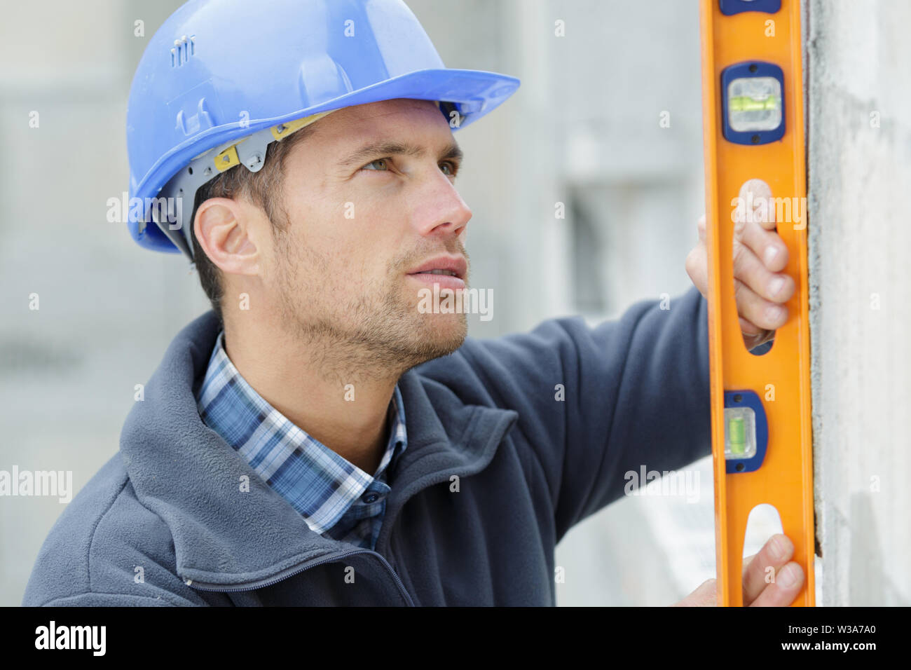 Construction holding spirit level bubble hi-res stock photography and ...