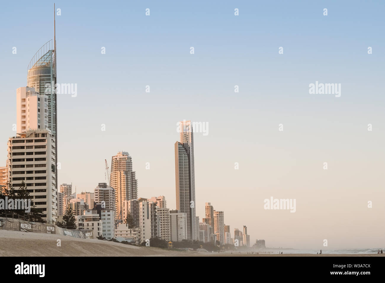 The early morning sun lights the Q1 Tower high rise which sits on the ...