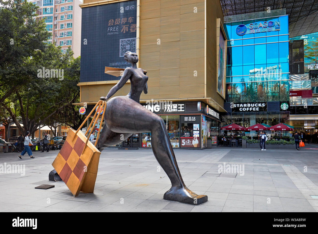 Statue of woman shopping in front of InTown Shopping Mall in Futian ...